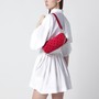 Manu Atelier Mini Cylinder bag in perforated red suede | TheDoubleF