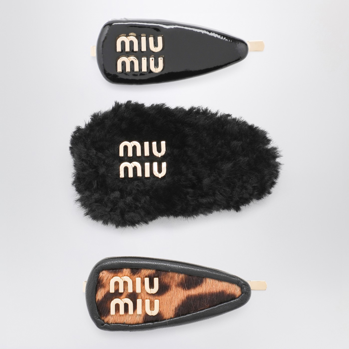 Miu Miu Set of black leather/cowhide/shearling clips | TheDoubleF